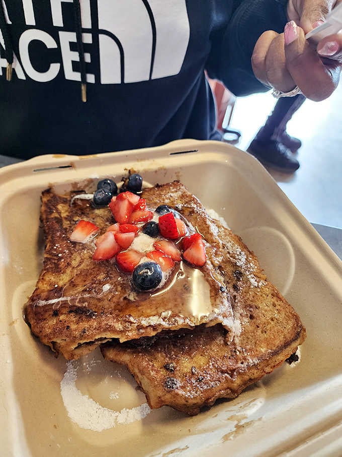 French toast topped with fresh berries and powdered sugar, sweet morning indulgence that tastes like a weekend should.