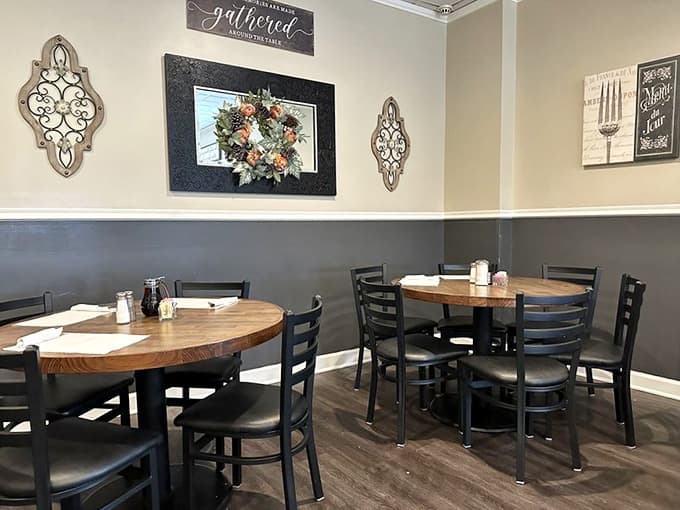 Simple tables, comfortable chairs, and that two-tone wall treatment that says "we're here for the food, not the decor."