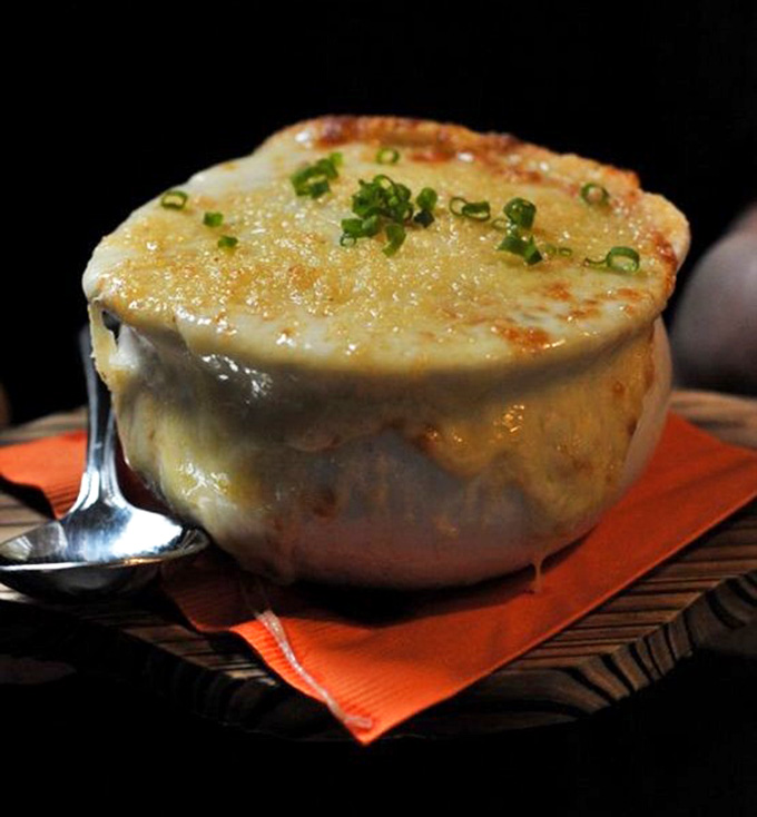 Bubbling, golden-topped French onion soup in its classic crock proves comfort food transcends trends and never goes out of style.