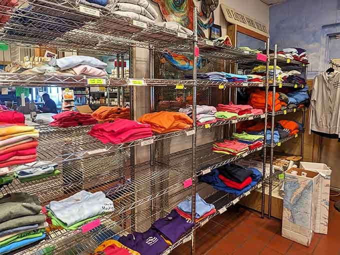 Colorful t-shirts stacked like a rainbow of wearable souvenirs, because you'll want to remember this meal forever.