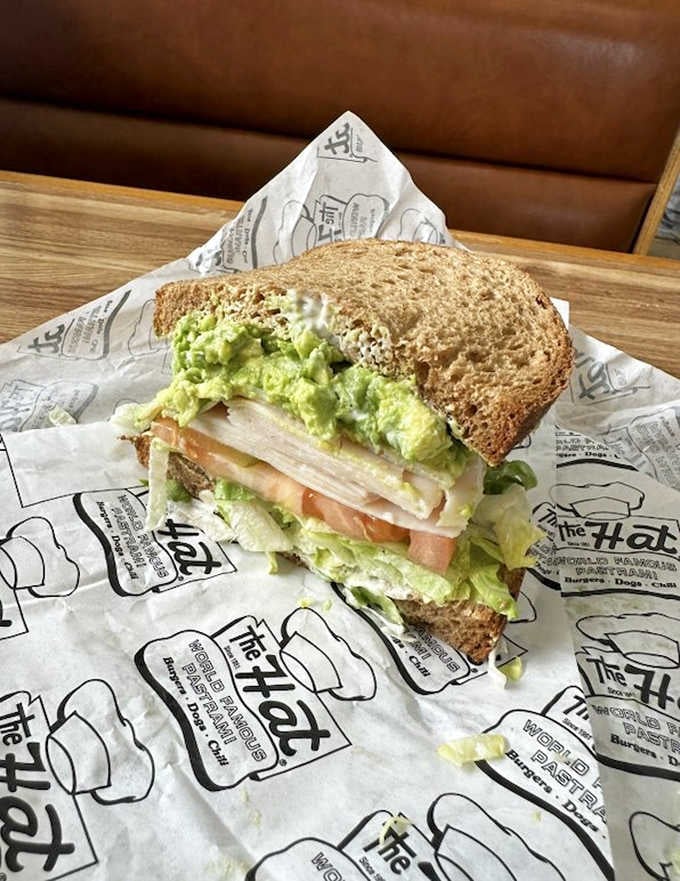 Turkey and guacamole on wheat bread offers a lighter option, though "lighter" is relative at The Hat.
