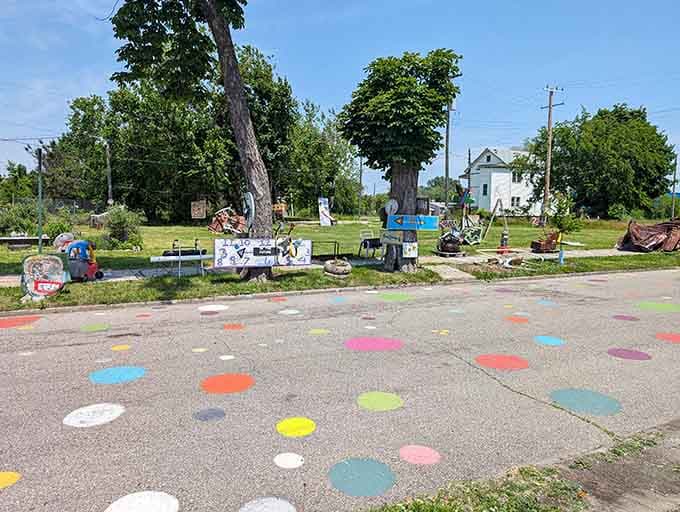 Painted circles dot the pavement like a cheerful path leading you deeper into this outdoor art wonderland.