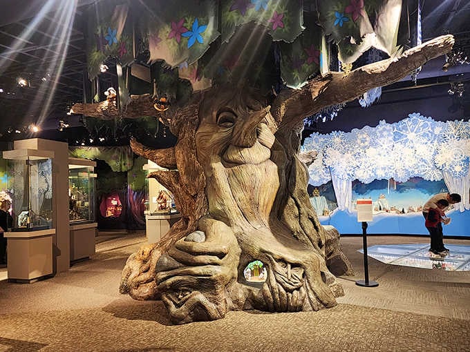 That magnificent tree sculpture anchors the Enchanted Realm gallery where fantasy meets extraordinary artistic skill.