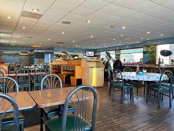 Spacious seating and water-themed murals make every meal feel like a lakeside vacation experience.