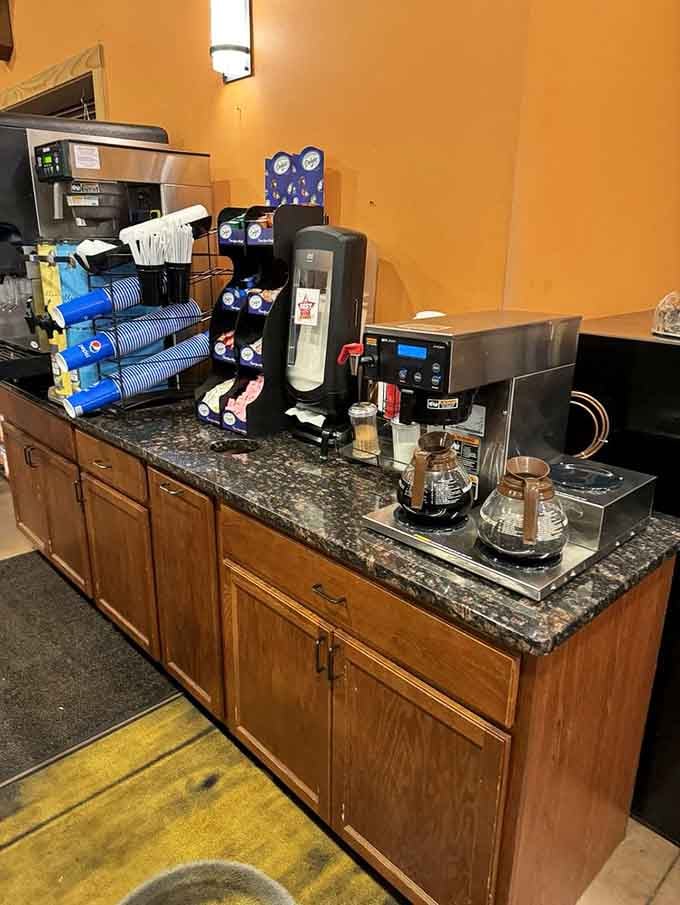 Self-serve coffee station with all the fixings, because sometimes you need caffeine before making important pastry decisions.