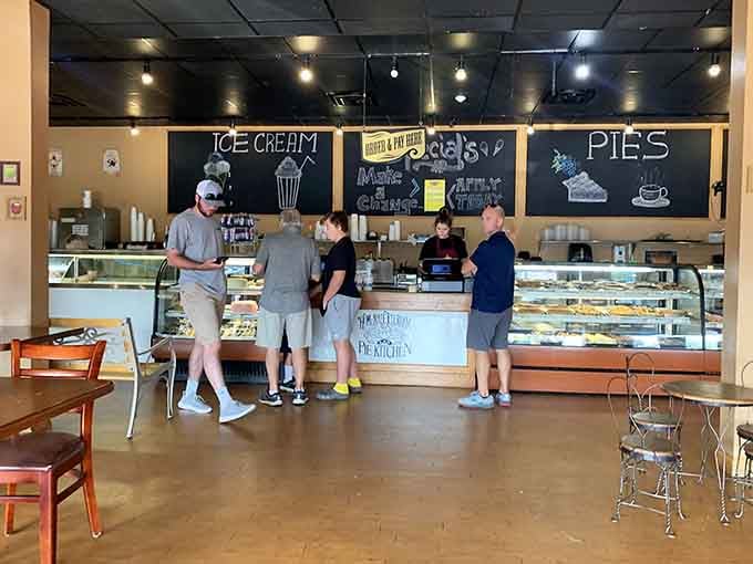 Happy customers at the counter making those tough decisions we all face in pie paradise.