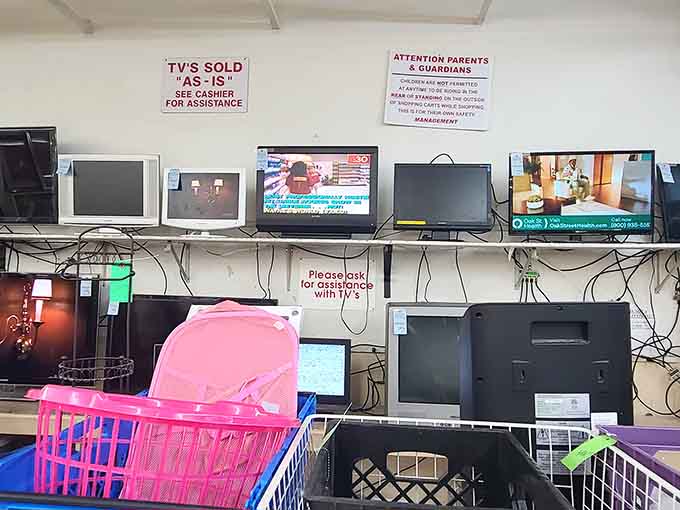 The electronics wall where yesterday's technology waits patiently for someone who still appreciates a good cathode ray tube screen.