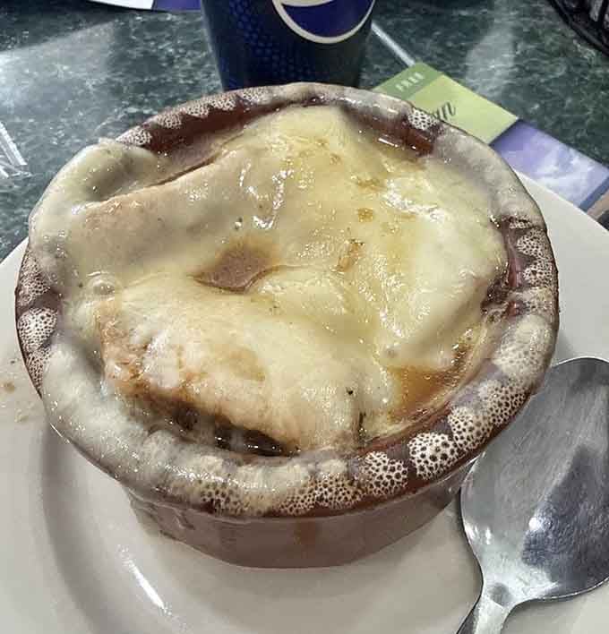 French onion soup with a cheese blanket so thick it could double as insulation for your winter cabin up north.
