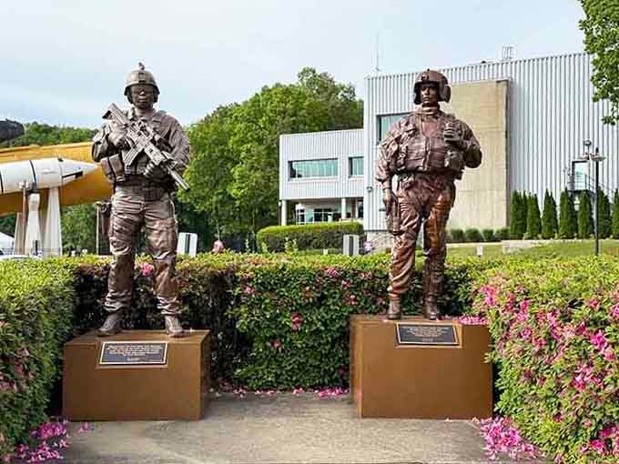 These bronze soldier statues stand as silent sentinels, honoring those who served in different ways than the astronauts.