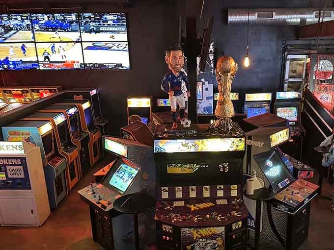 Vintage arcade cabinets standing ready like old friends waiting to remind you that you're still terrible at Galaga.
