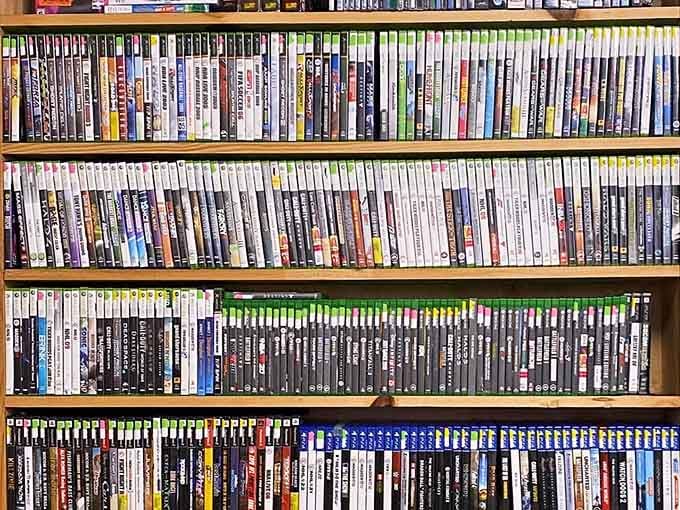 Video games stacked high enough to make your inner teenager weep with nostalgic joy and possibility.