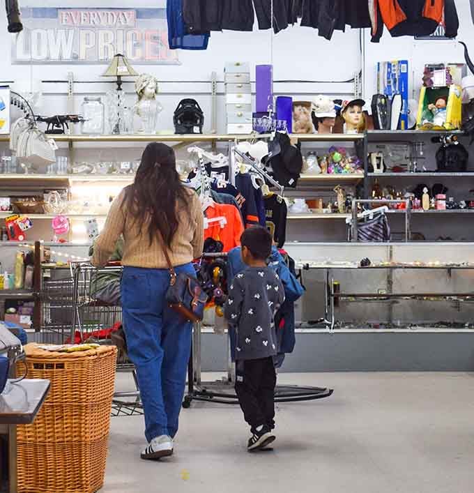 Mother and child navigate the aisles together, creating memories while hunting for household treasures and deals.