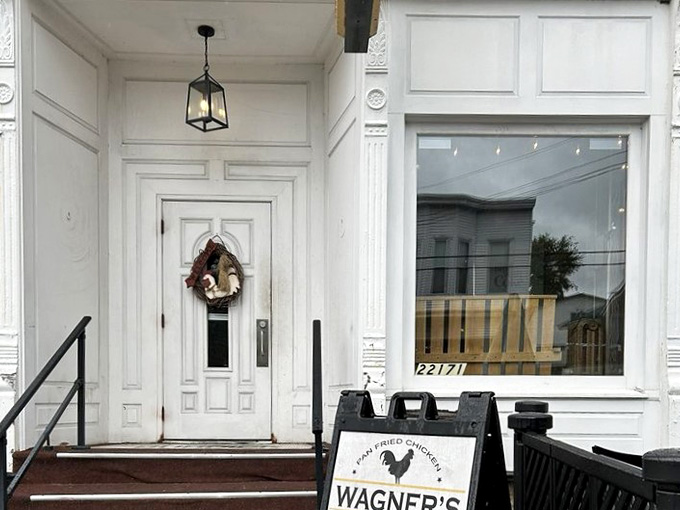 That welcoming white entrance with its wreath says "come on in," and trust me, you absolutely should take that invitation.