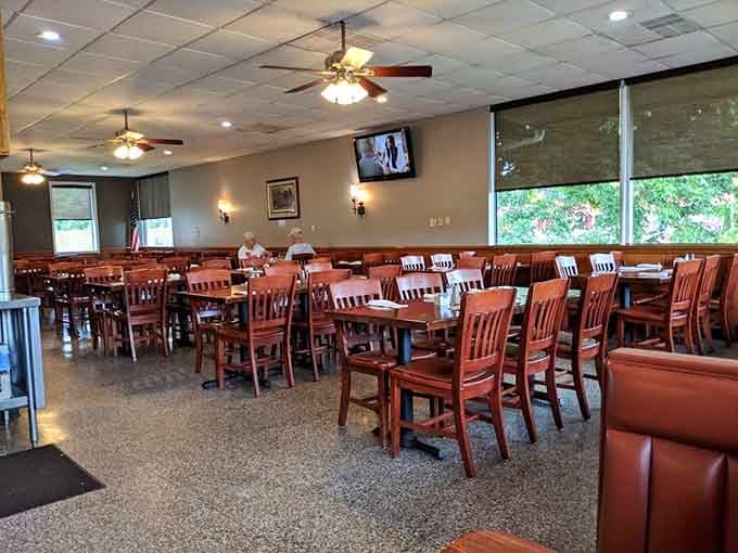 Ceiling fans and comfortable booths create a relaxed dining environment where conversation flows as freely as the sweet tea.