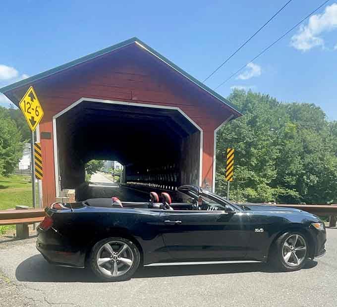 Nothing says "I appreciate fine engineering" quite like posing your convertible in front of a 137-foot wooden masterpiece.