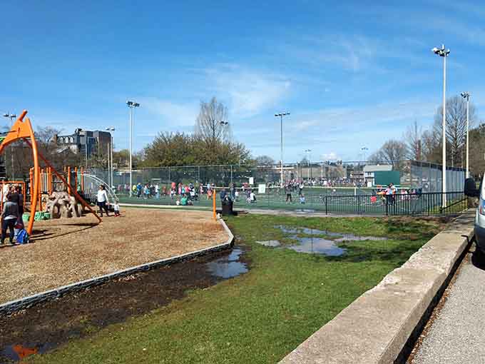 Tennis courts nearby offer additional recreation options, making this a true multi-generational gathering spot for the whole community.
