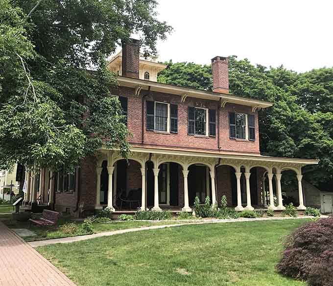 The Hurlbut-Dunham House's wraparound porch is basically an invitation to sit, sip lemonade, and judge passersby elegantly.