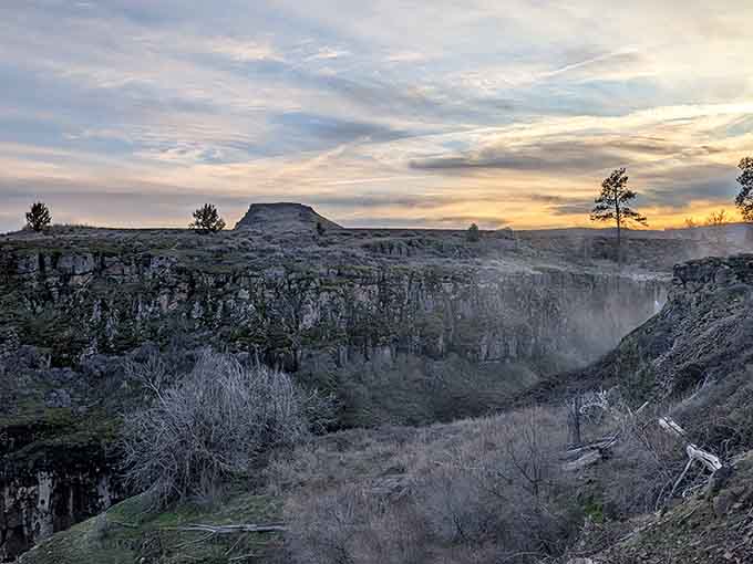 Sunset transforms the canyon into something otherworldly, painting the mist with colors that cameras barely capture.