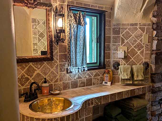 Even the bathroom gets the royal treatment with ornate tilework and fixtures that make everyday routines feel downright regal.