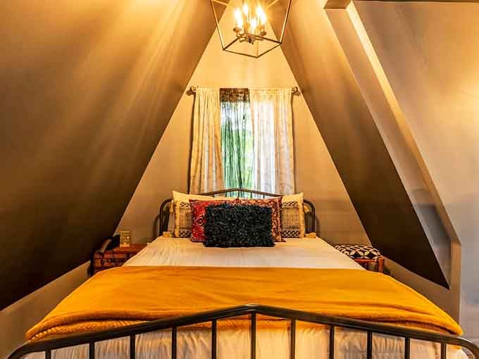 The loft bedroom cocoons you in golden light, perfect for reading spellbooks or just napping peacefully.