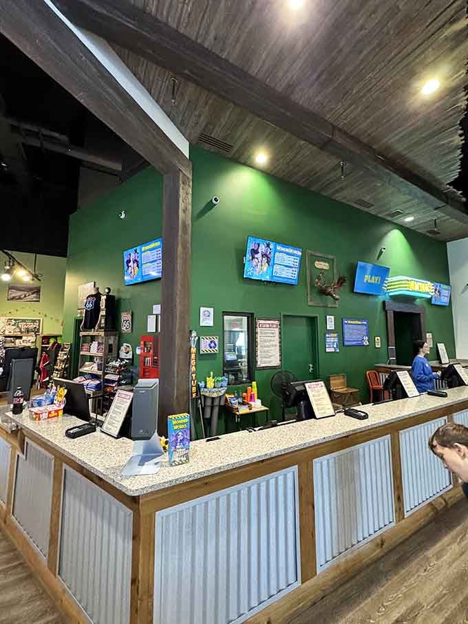 The ticket counter where your adventure into architectural madness officially begins with friendly staff ready to help.