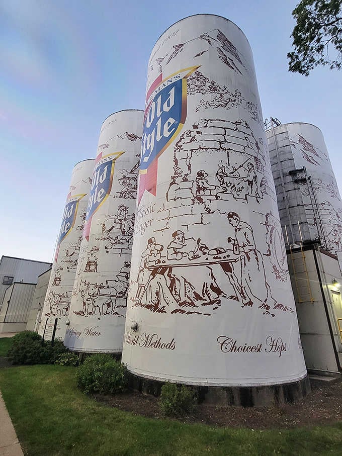 Those charming vintage illustrations of brewers at work wrap around the tanks, celebrating the artistry behind every pour.