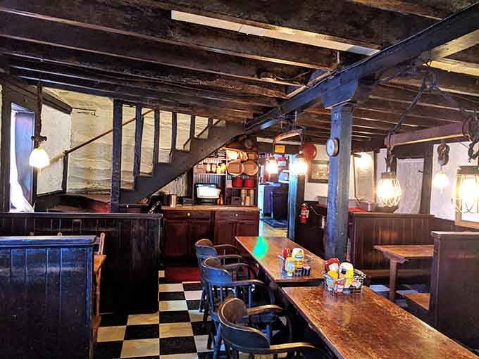 Dark wood booths and intimate lighting create cozy corners where conversations flow as freely as the beer on tap.