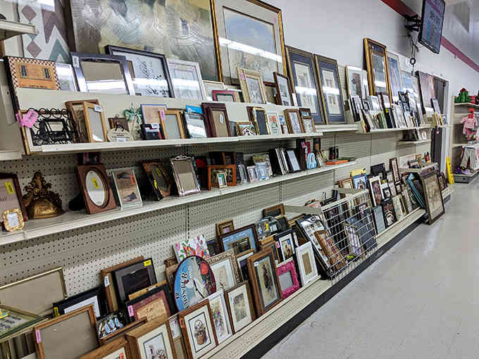 Picture frames of every size and style lean against shelves, ready to showcase your memories without the boutique markup.