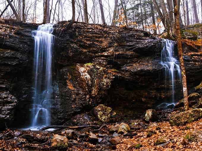 The weathered stonework stands testament to history while water continues its timeless journey over the rocks.
