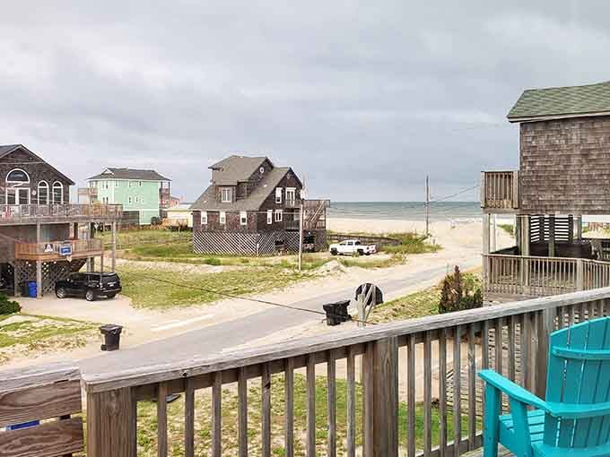 Beach houses stand on stilts like patient herons waiting for the next wave to roll in.
