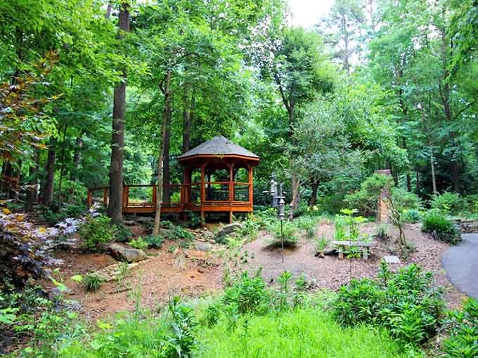 A wooden gazebo perches above native plantings, offering the perfect spot to contemplate life's important questions or nothing at all.