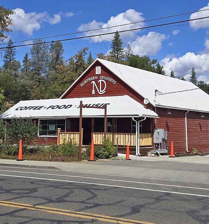 The red barn-style building promises coffee and comfort, two things every mountain morning desperately needs.