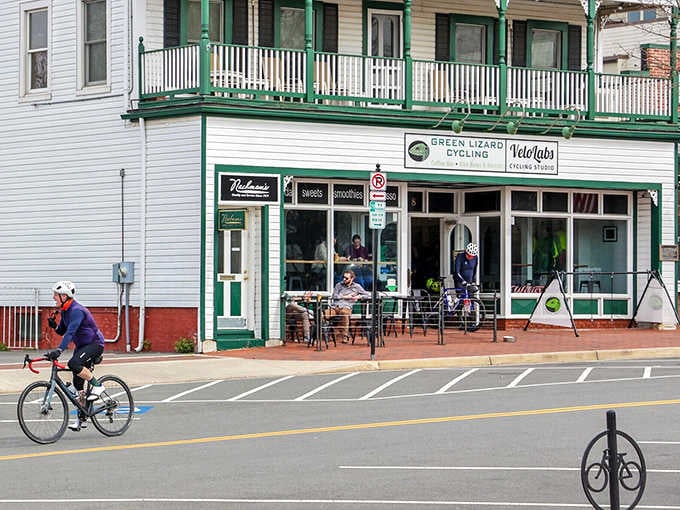 Outdoor seating and cheerful green trim invite cyclists and pedestrians to stop and stay awhile longer.