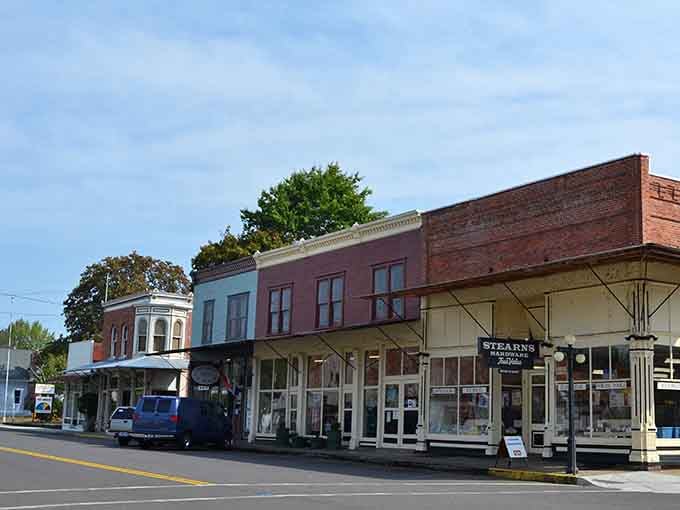 Pastel storefronts with covered porches invite leisurely browsing, the kind that requires no schedule and rewards curiosity.
