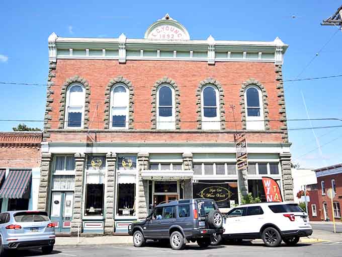 The ornate brick building with mint-green trim stands proud like a grande dame of Main Street.