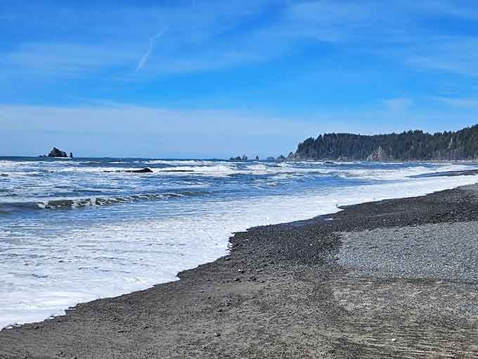 That pebbly beach stretches endlessly, perfect for contemplative walks where your only company is crashing waves and seabirds.