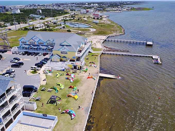 Colorful kites dance above the waterfront in a celebration of wind, water, and endless summer days.