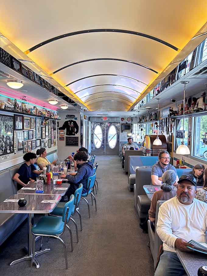 Happy diners filling turquoise booths under curved ceilings show that great food brings people together across all generations beautifully.