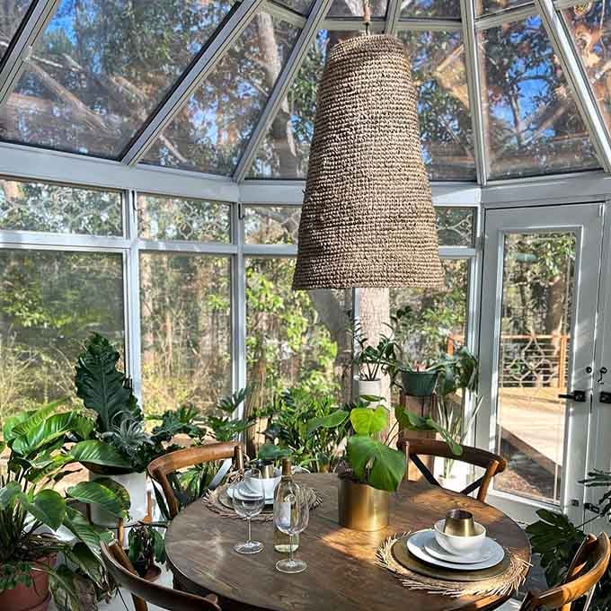 Dining surrounded by windows and greenery beats any restaurant view you've had this year, guaranteed.