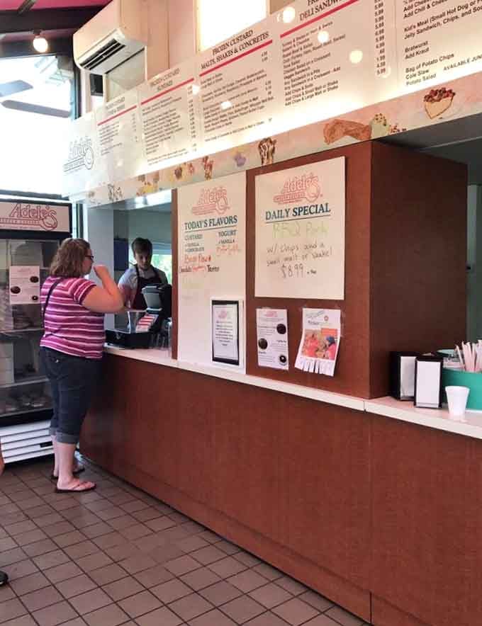The order counter where dreams come true and decisions get made, though honestly, you can't go wrong with anything on that board.