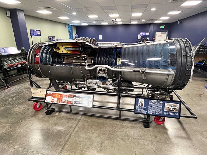 A cutaway jet engine reveals the intricate turbine blades and engineering marvel that makes modern flight possible for everyone.