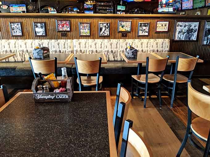 Classic sports bar seating with vintage photos, where comfort meets nostalgia in perfect harmony every time.
