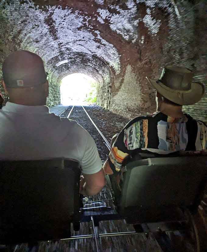 Inside the tunnel looking toward daylight while pedaling creates that perfect mix of adventure and anticipation together.