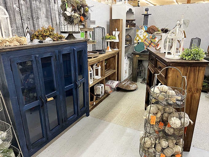 Painted cabinets in navy and natural wood offer farmhouse charm that interior designers would pay premium prices for.