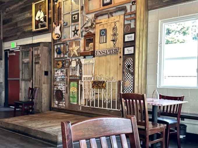 Wall decorations that spell "INSPIRE" alongside vintage finds create an atmosphere that's genuinely lived-in and loved.