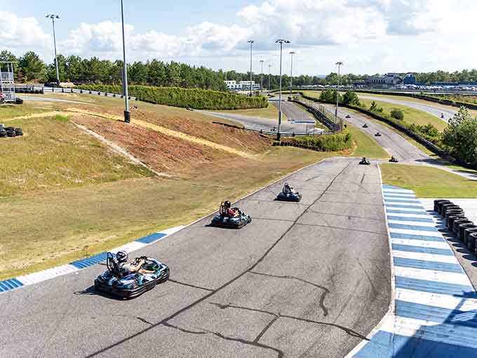 Four competitors charge down the straightaway, each searching for that crucial advantage that'll put them ahead at the finish.