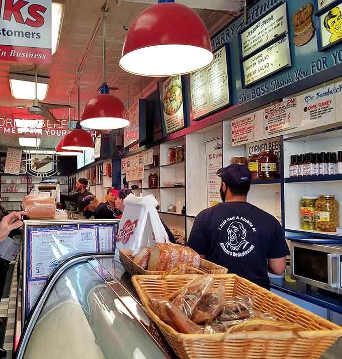 The crew behind the counter slicing your sandwich with the precision of seasoned deli surgeons.