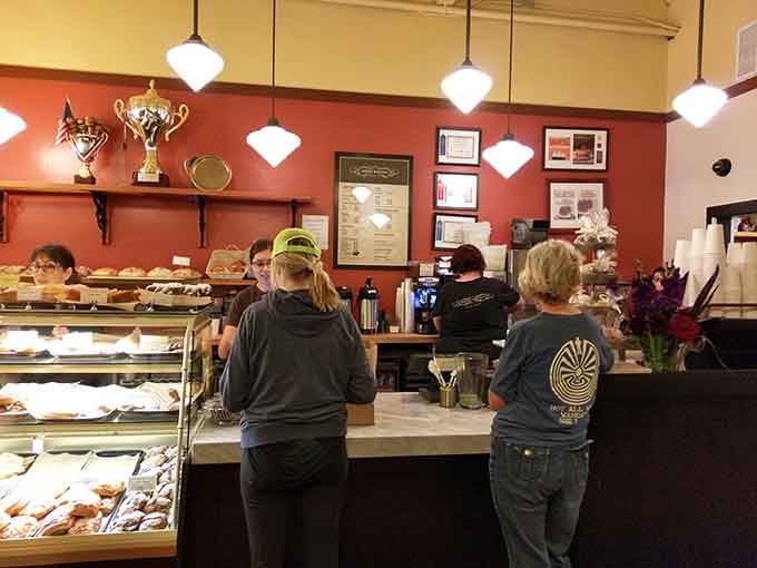 Behind that counter, magic happens daily at hours when most sensible people are still dreaming about breakfast.