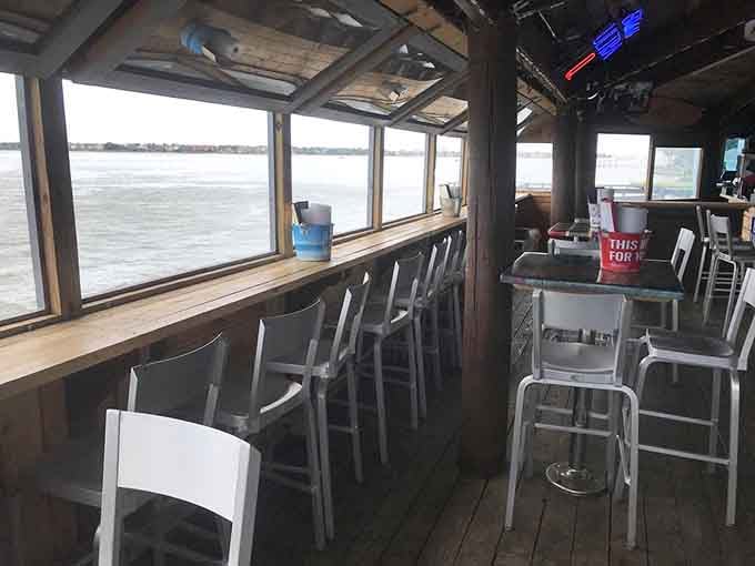 Bar seating with panoramic water views means every seat is technically the best seat in the house here.