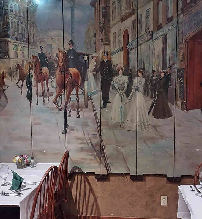 Large-scale artwork depicting Victorian street scenes adds historical charm without overwhelming the intimate dining space you're enjoying.